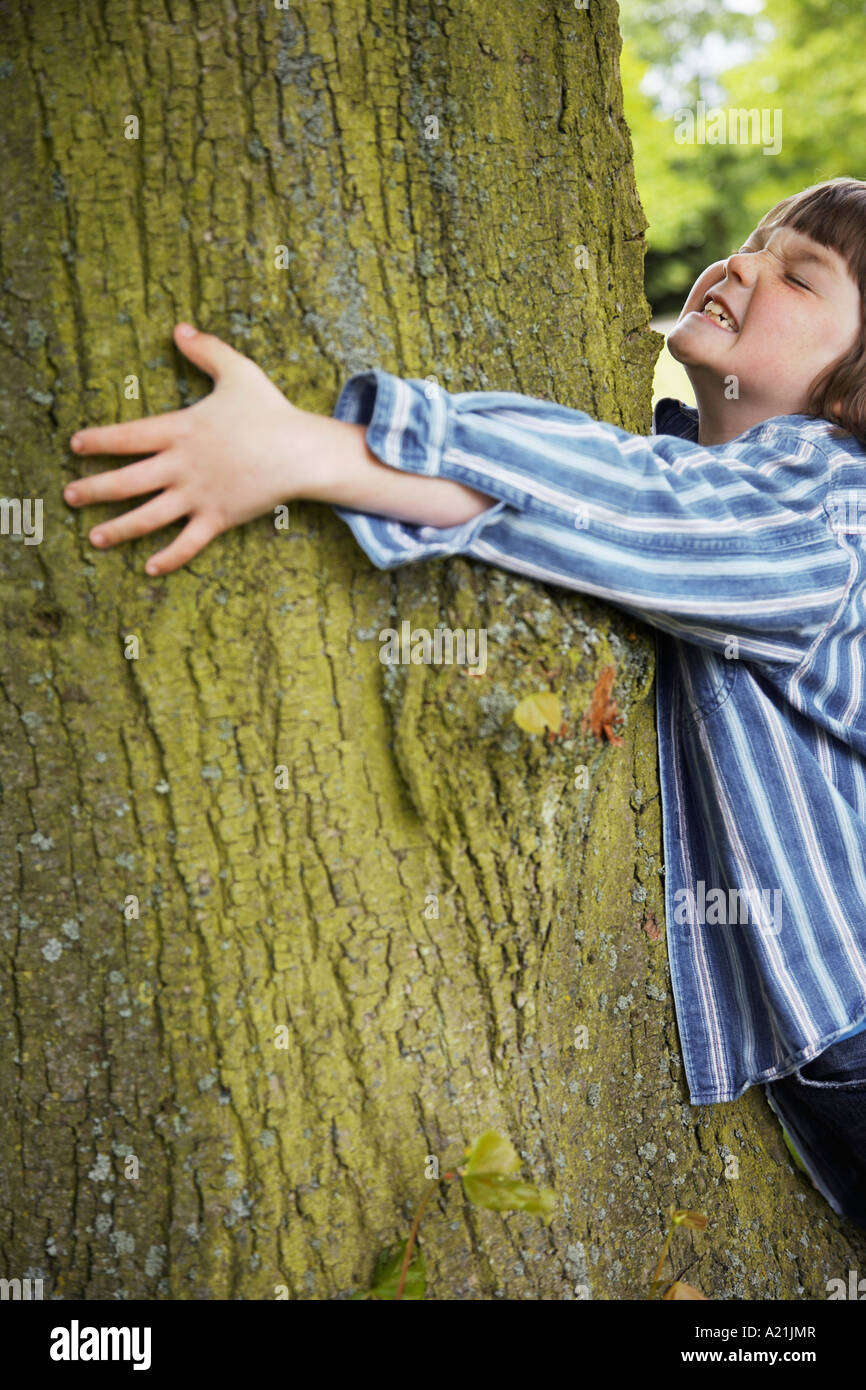 Boy Hugging Tree High Resolution Stock Photography and Images - Alamy