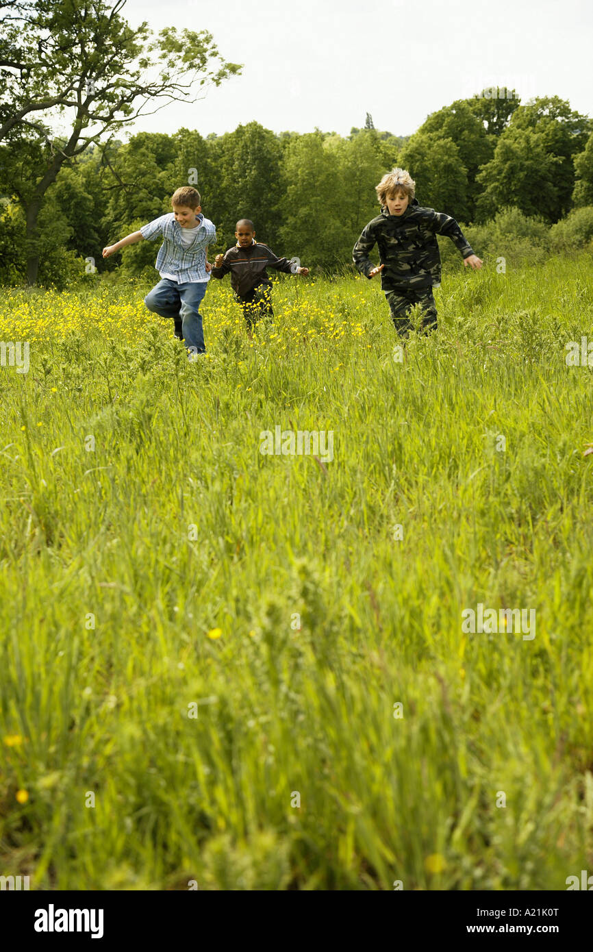 Boys Running Through Field High Resolution Stock Photography and Images ...