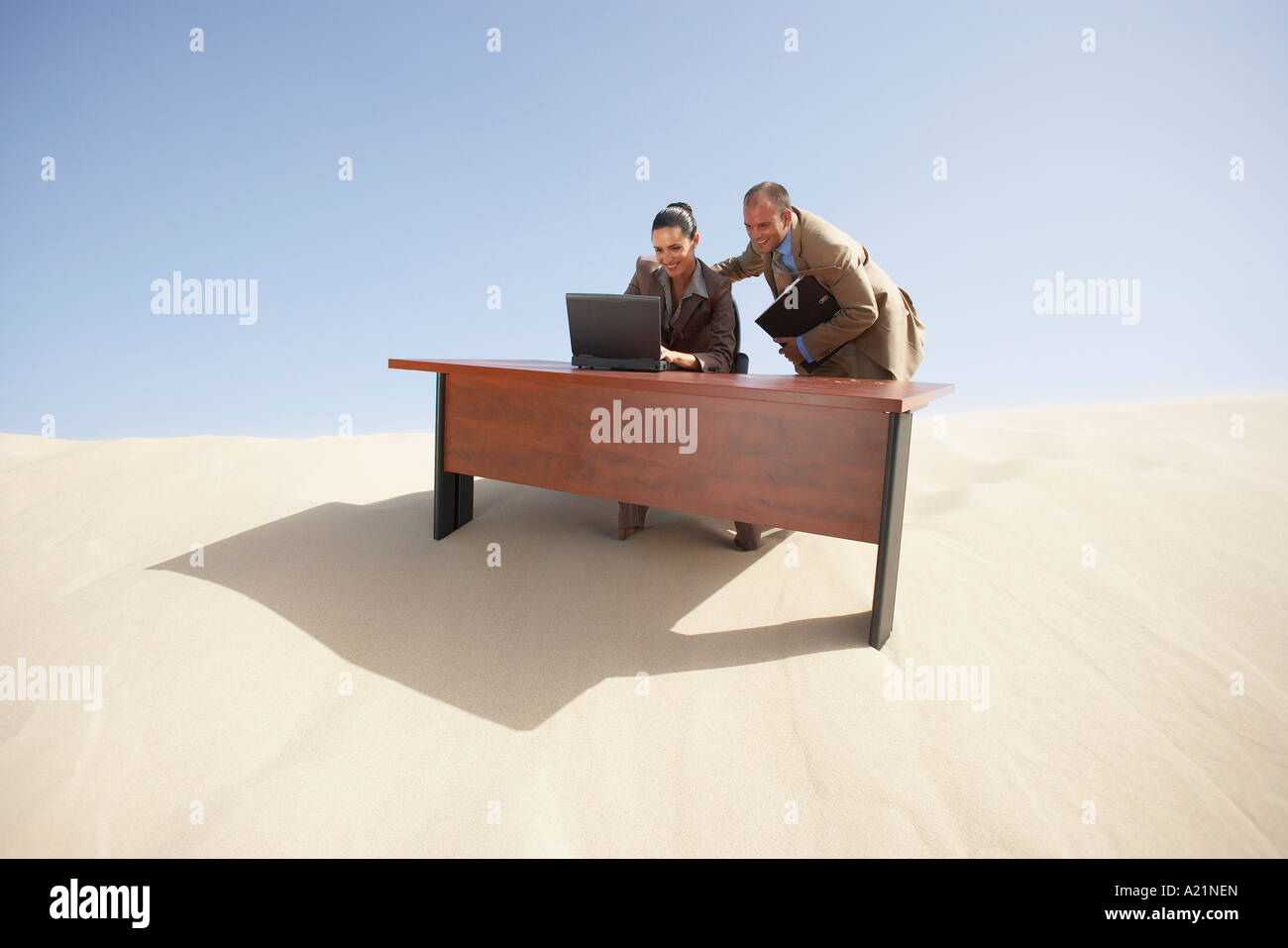 Man sitting desert dune looking view hi-res stock photography and ...