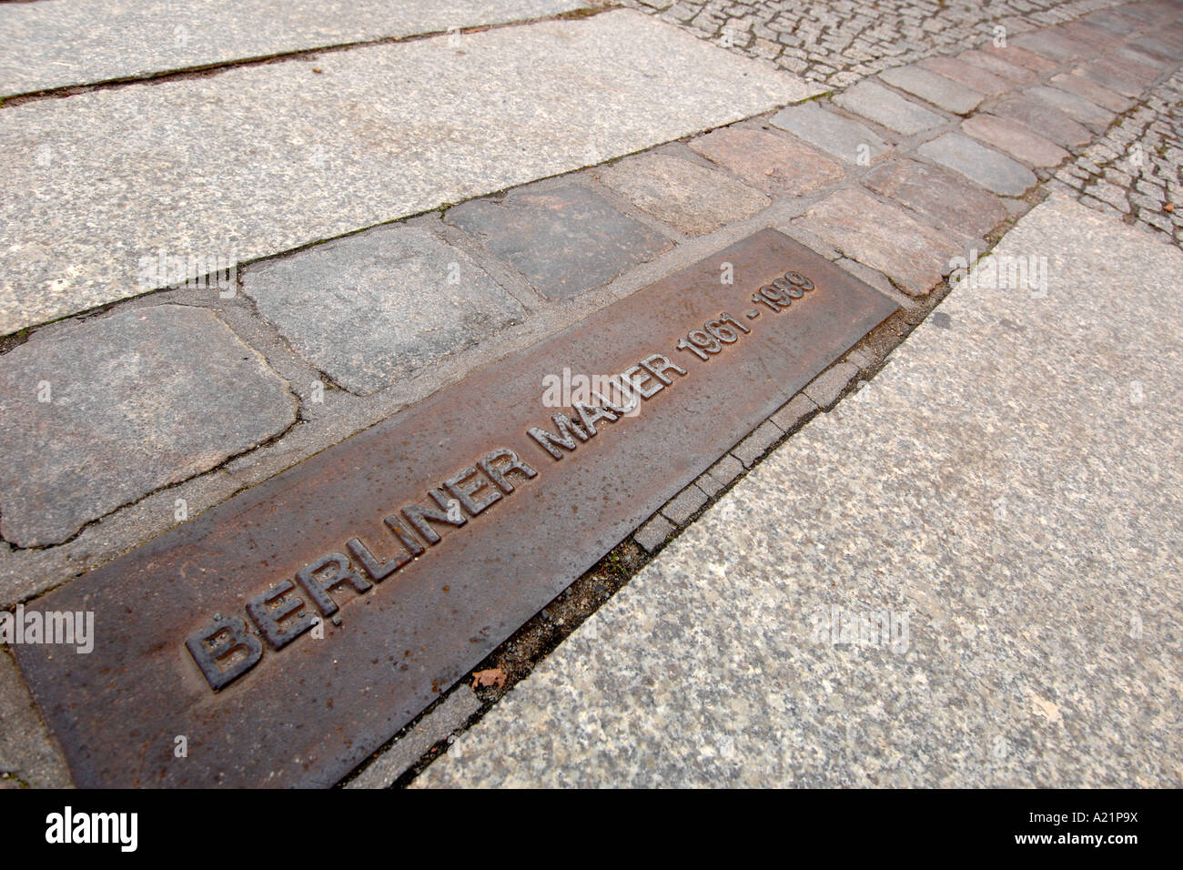 Commemorative plaque and line of double paving stones marking the ...