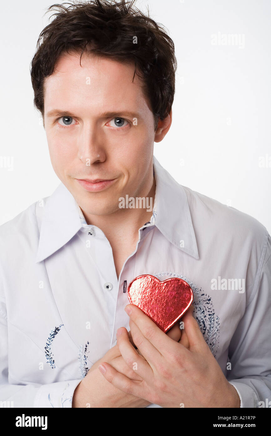 Man Holding Heart-Shaped Box Stock Photo - Alamy