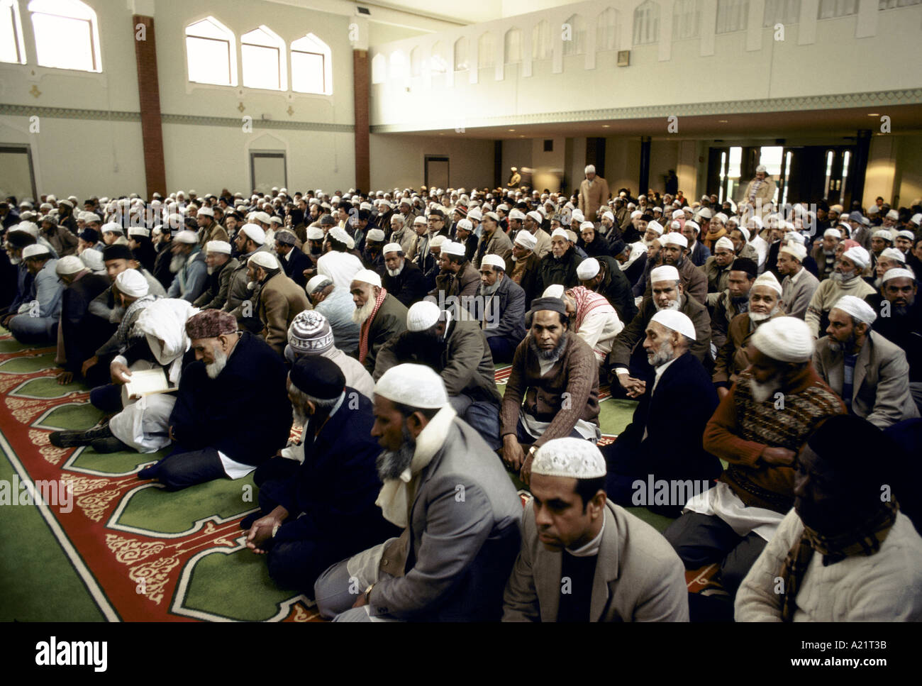 Worshippers praying on the floor in the Whitechapel mosque, London, UK ...