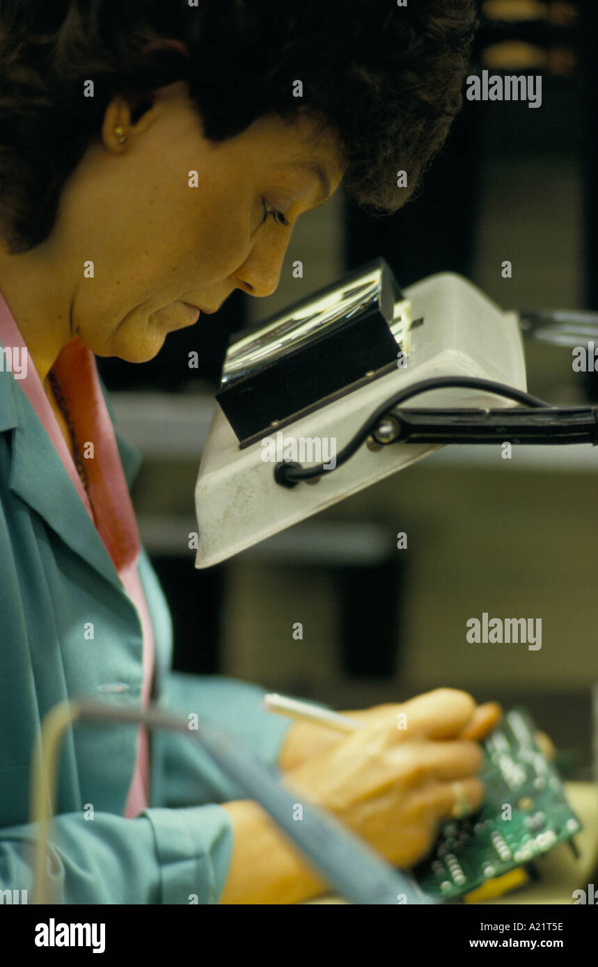 A factory worker checking a circuit board Stock Photo - Alamy