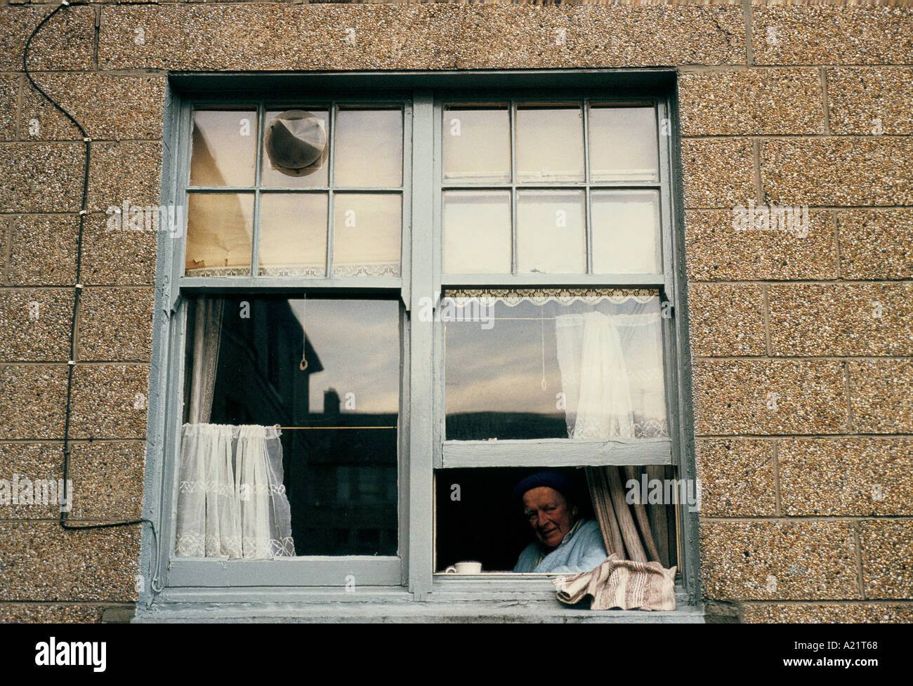 A woman at the window, Possil Park Estate, Glasgow, Scotland, UK Stock ...