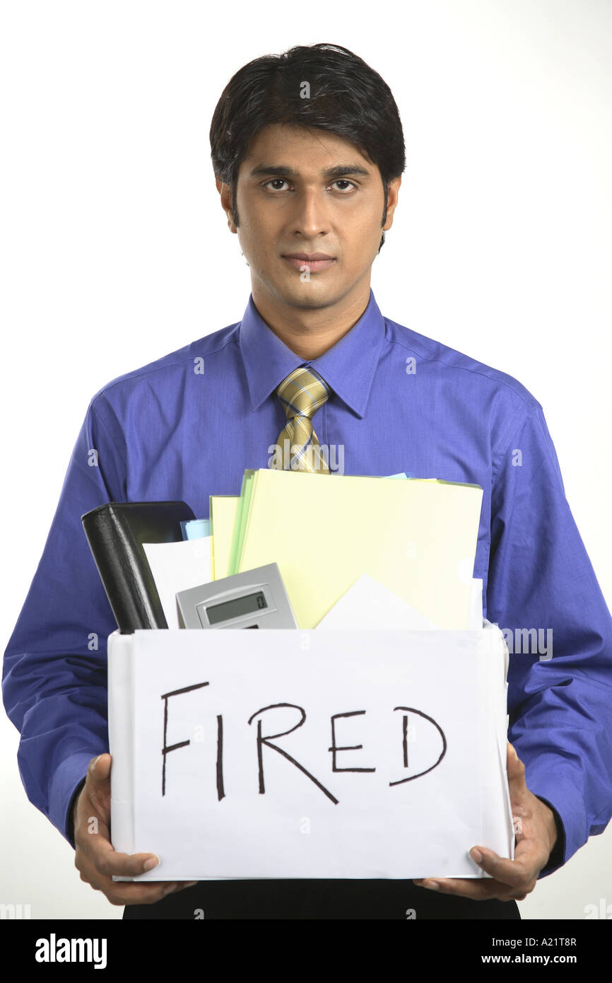 Executive holding the box Stock Photo - Alamy