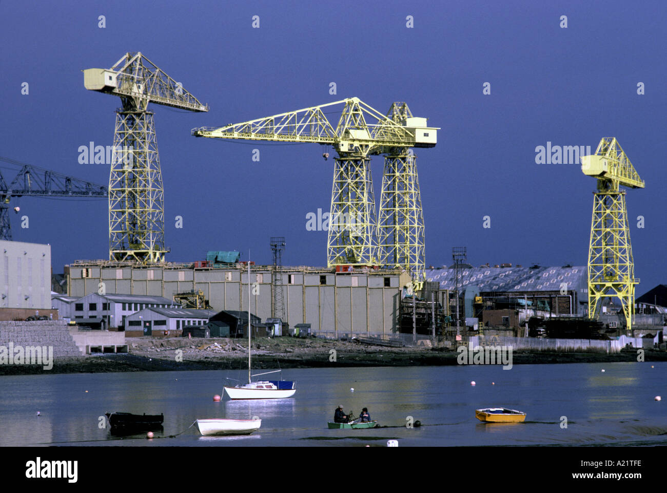 View across river of Vickers shipyard at Barrow in Furness United ...