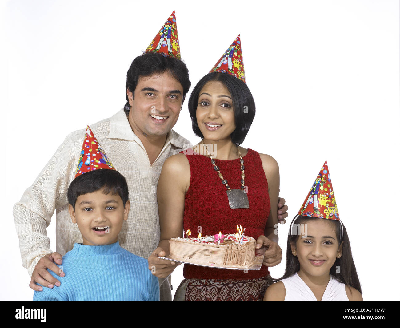 South Asian Indian family with father mother son and daughter smiling ...