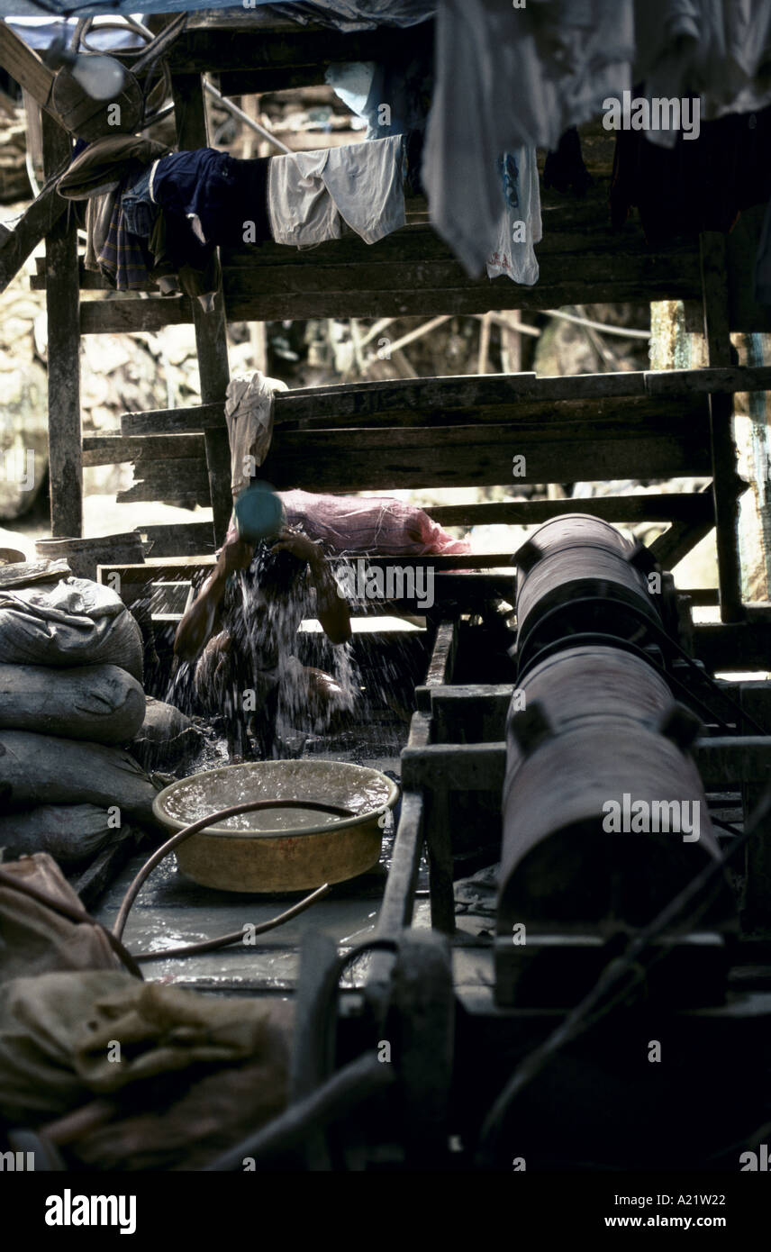 An abantero bathes in a ballmill that is also home, Mount Diwata ...