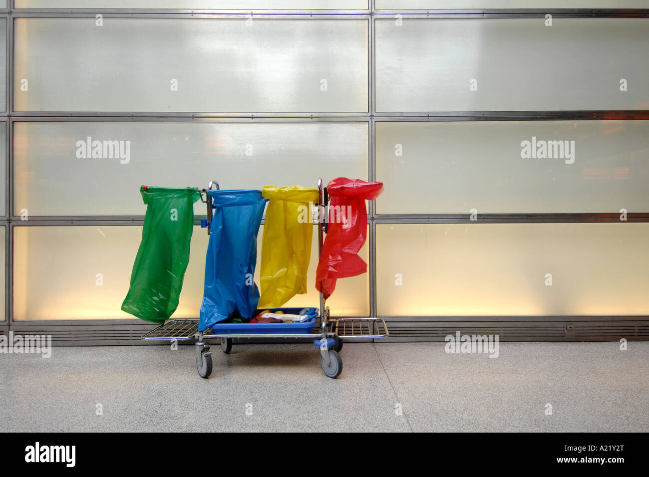 Colourful recycling refuse trolley at a train station in East Berlin ...