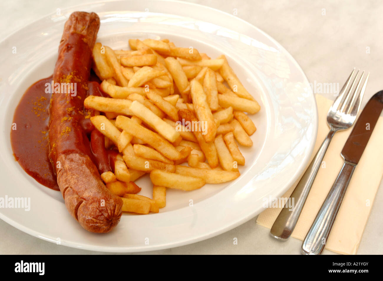 German currywurst with French Fries Stock Photo - Alamy