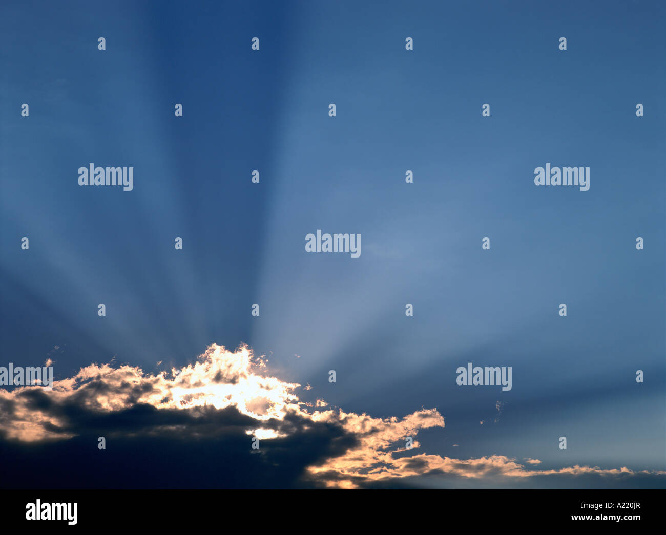 Crepuscular rays and passing storm Stock Photo - Alamy