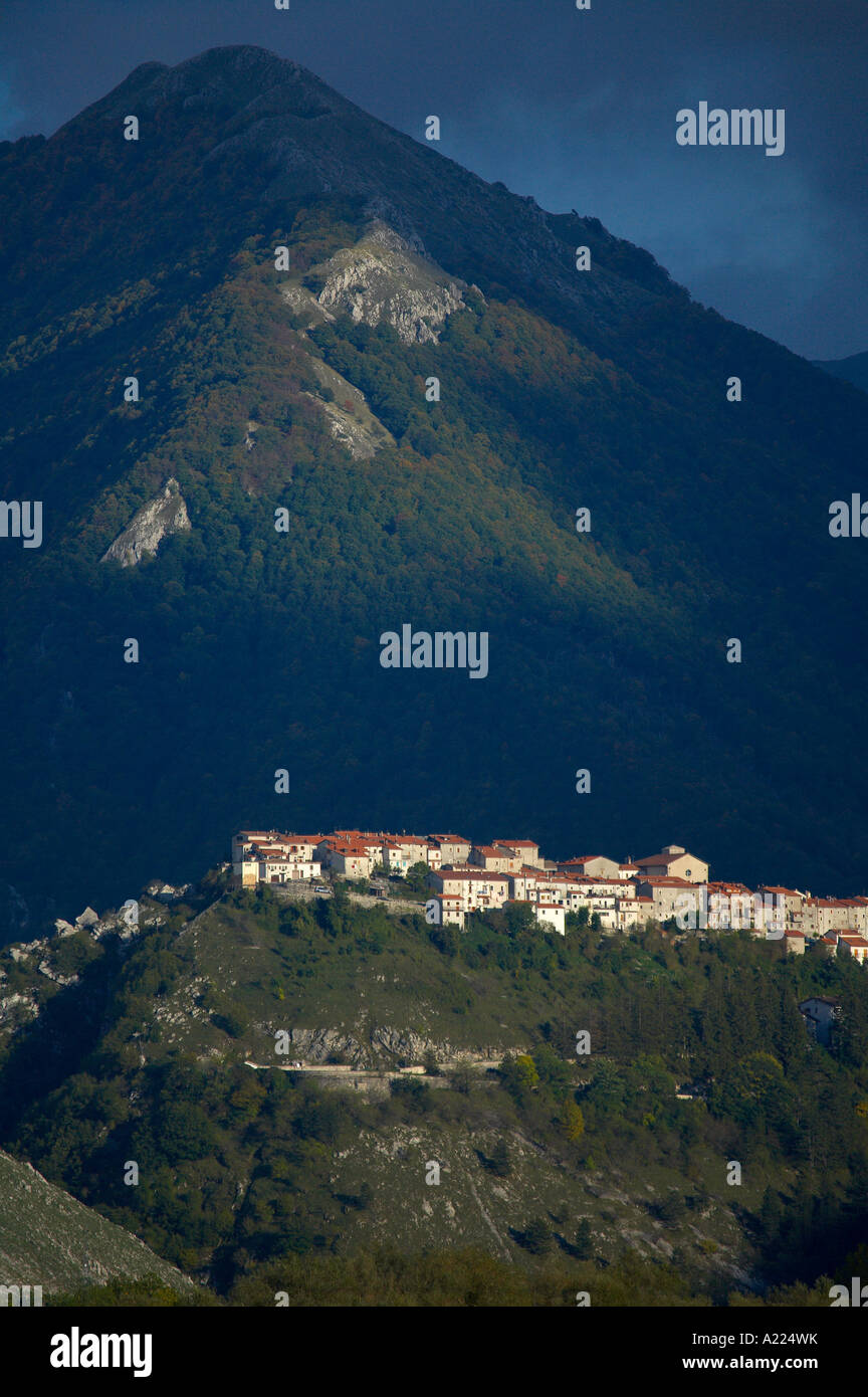 the village of Opi picked out by a shaft of evening light beneath the ...