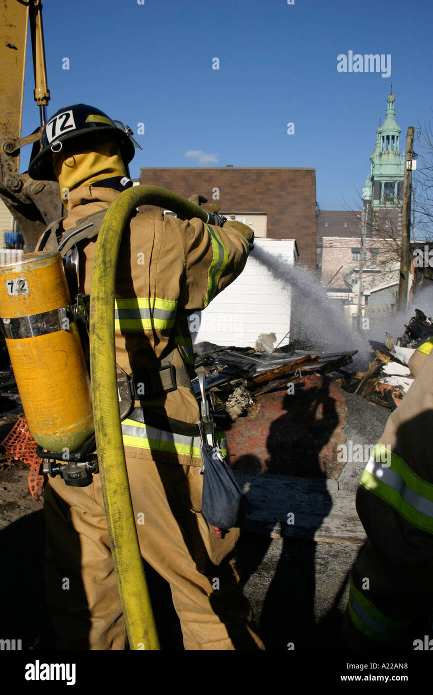 Fireman in action Stock Photo - Alamy