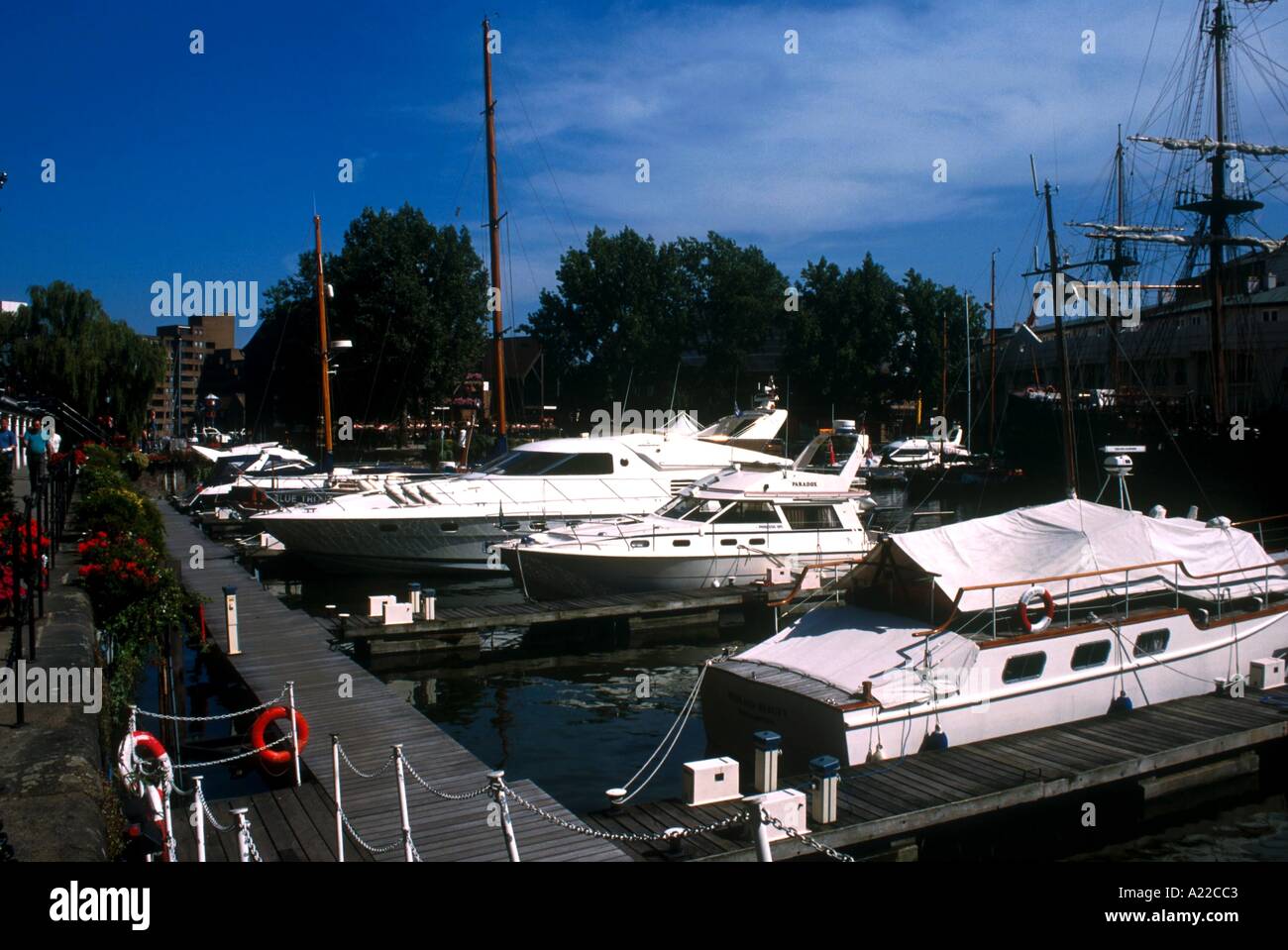 Boats moored in St Katherines Dock London England UK K Hudson Stock ...