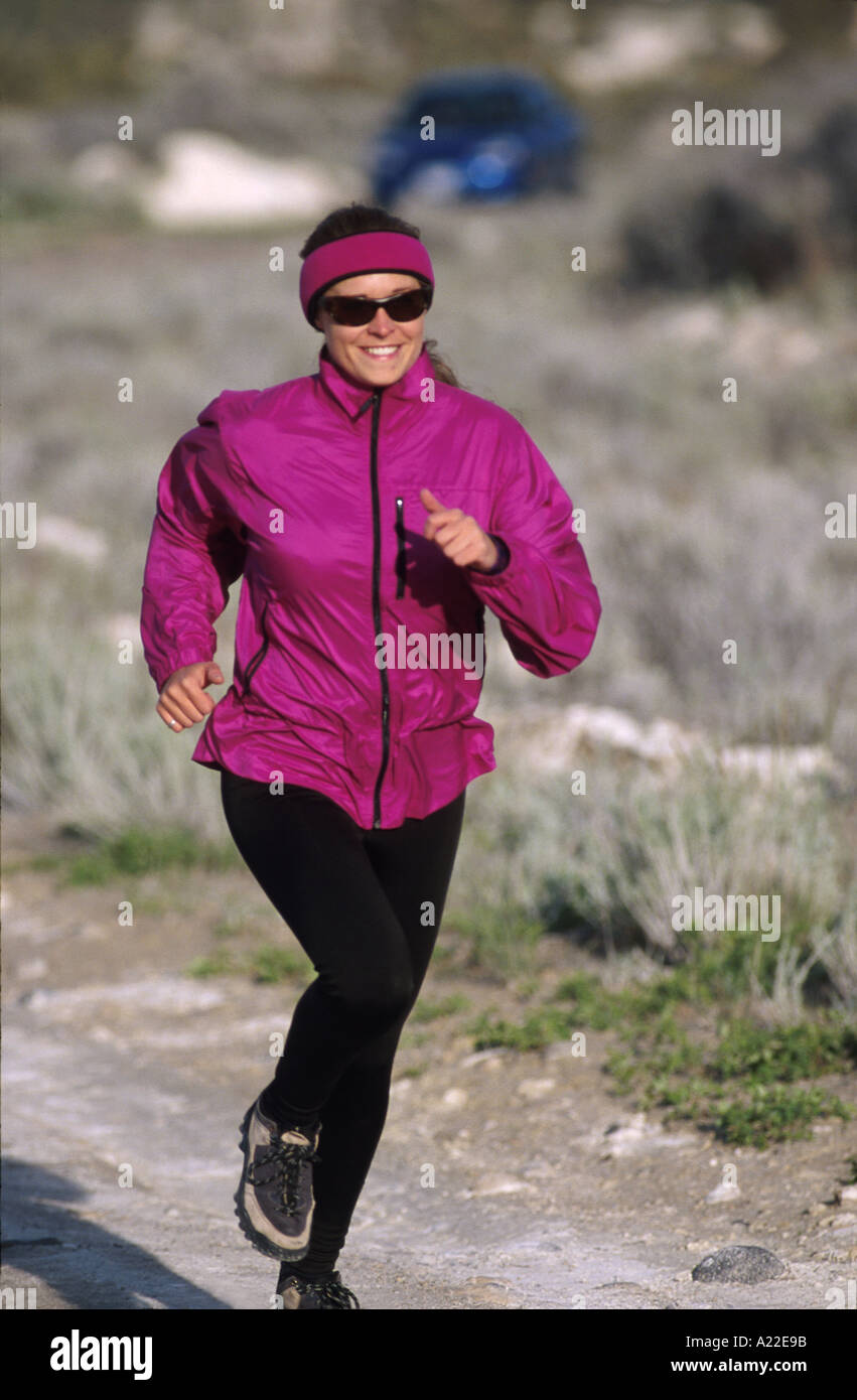 Woman Running on Trail Stock Photo - Alamy