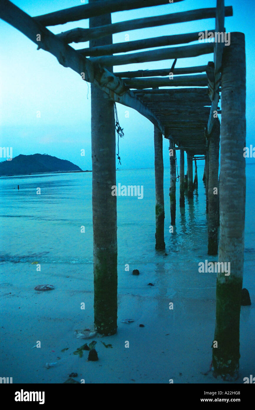 Log dock on the beach, Thailand Stock Photo - Alamy