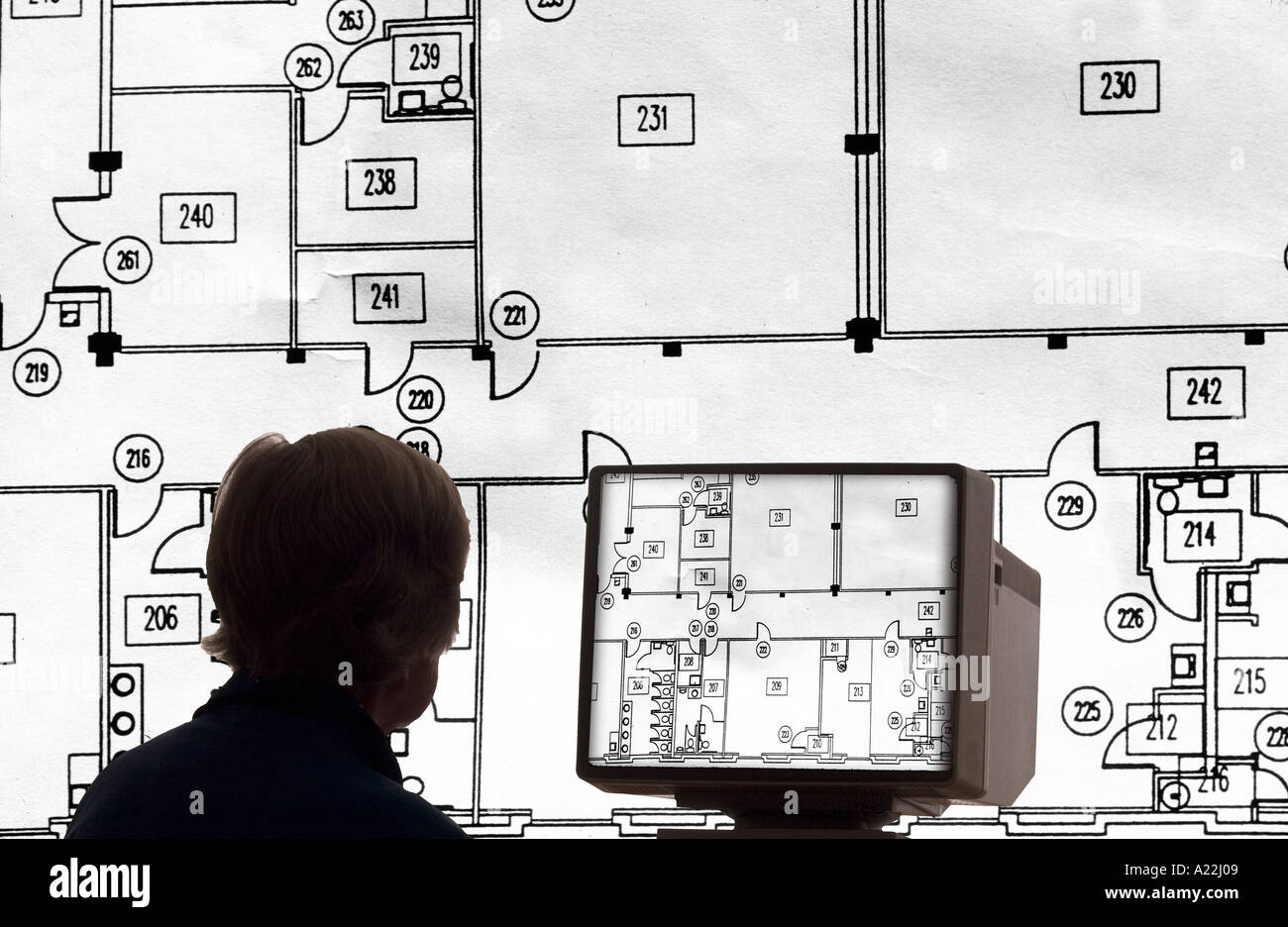 architect studying building plans and layout on computer monitor Stock ...