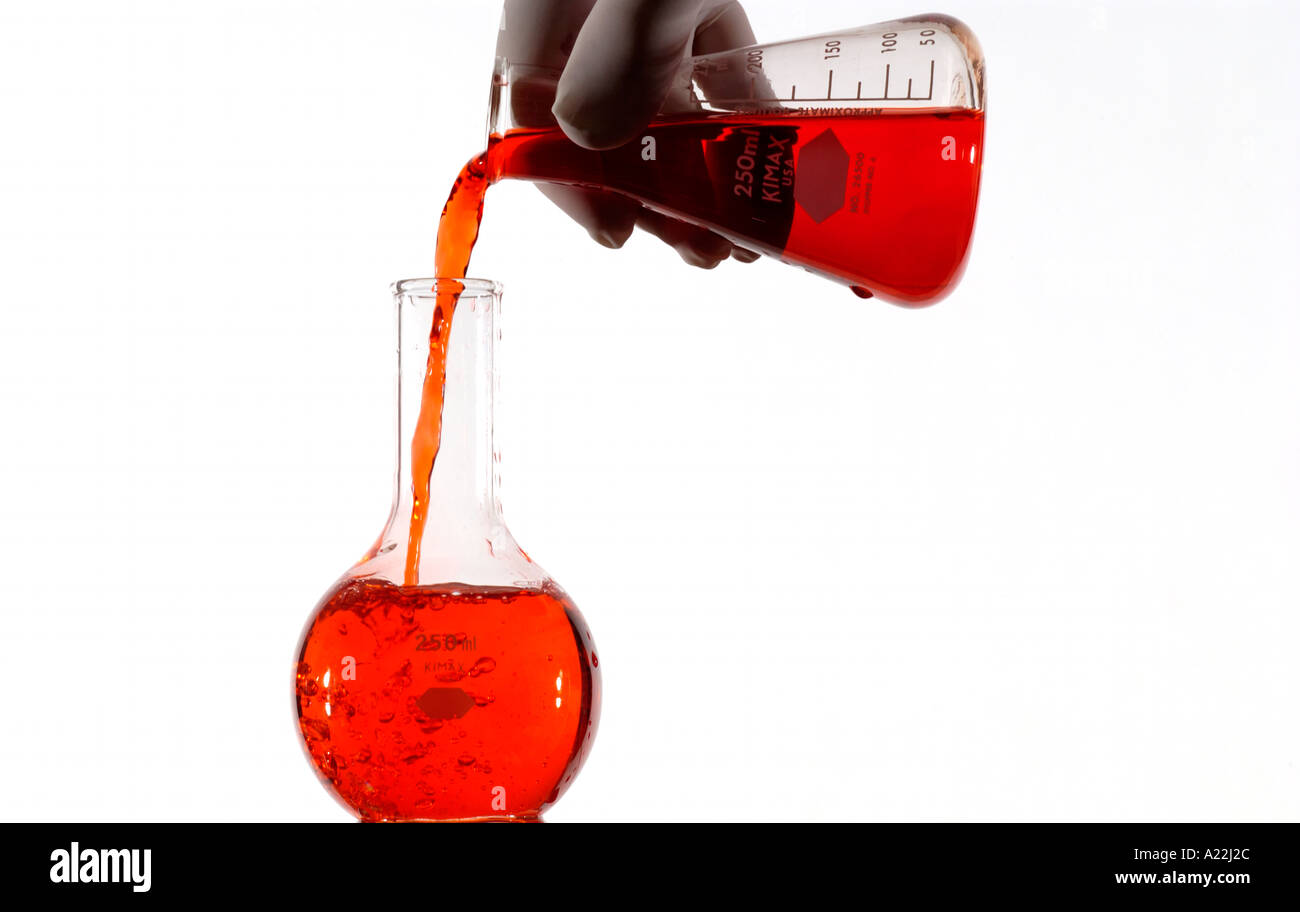 hand with two beakers in lab Stock Photo - Alamy