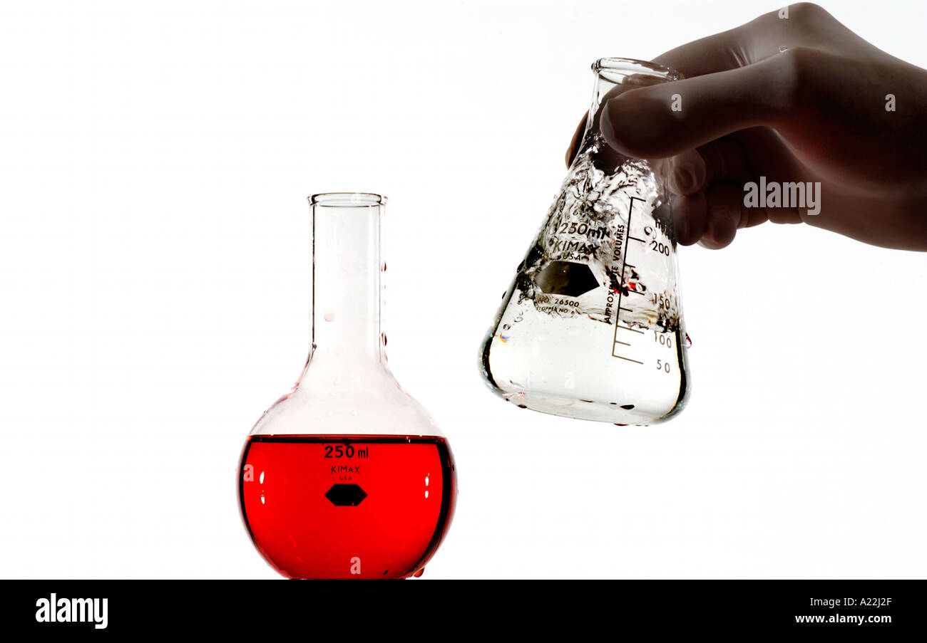 hand with two beakers in lab Stock Photo - Alamy