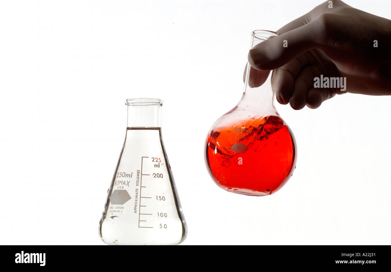 hand with two beakers in lab Stock Photo - Alamy