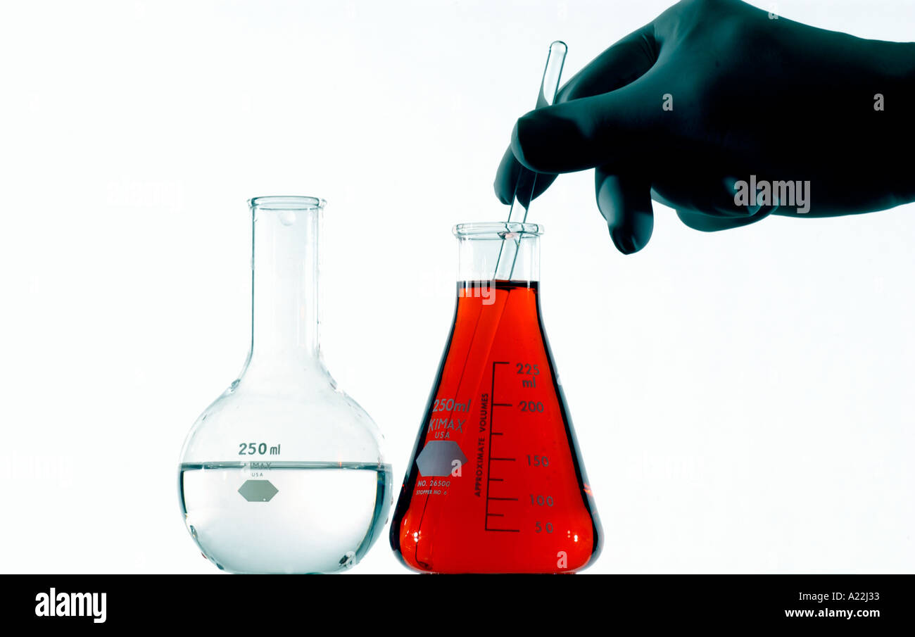 hand with two beakers in lab Stock Photo - Alamy