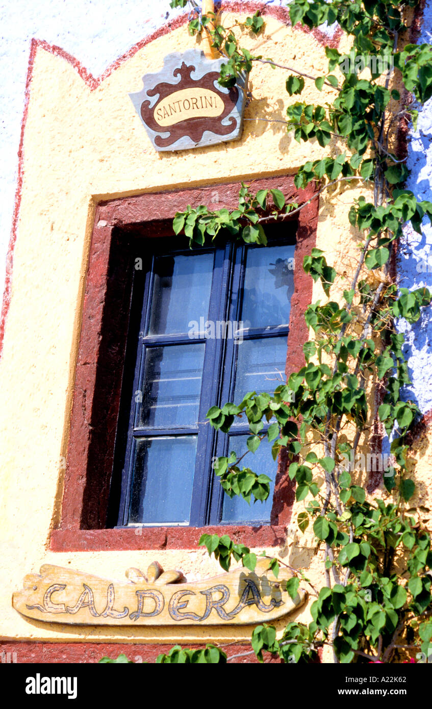 traditionally painted painted window on a house on the Greek volcanic ...