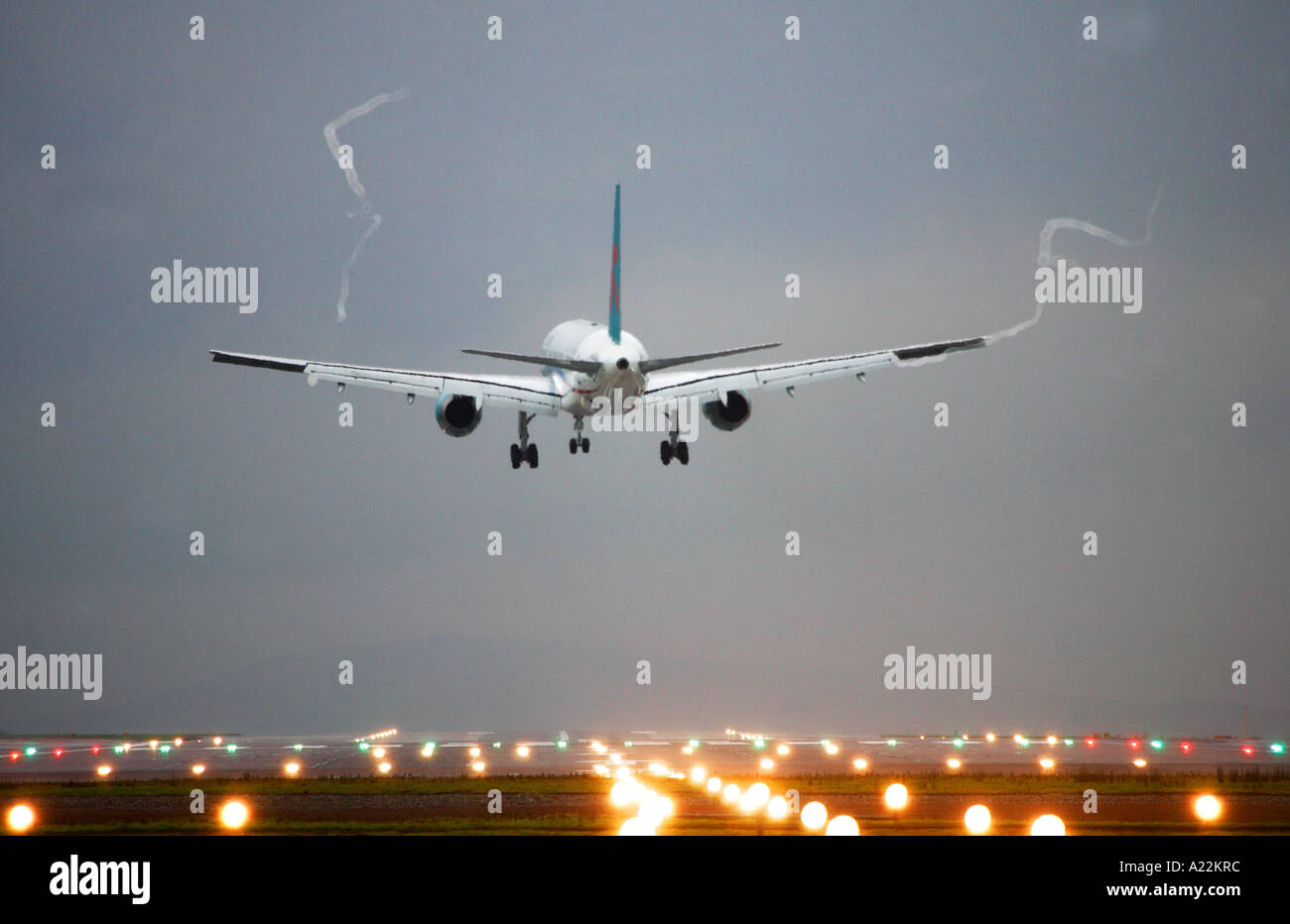 Boeing 757 gliding over the ILS with vortex and vortices from wing tips ...