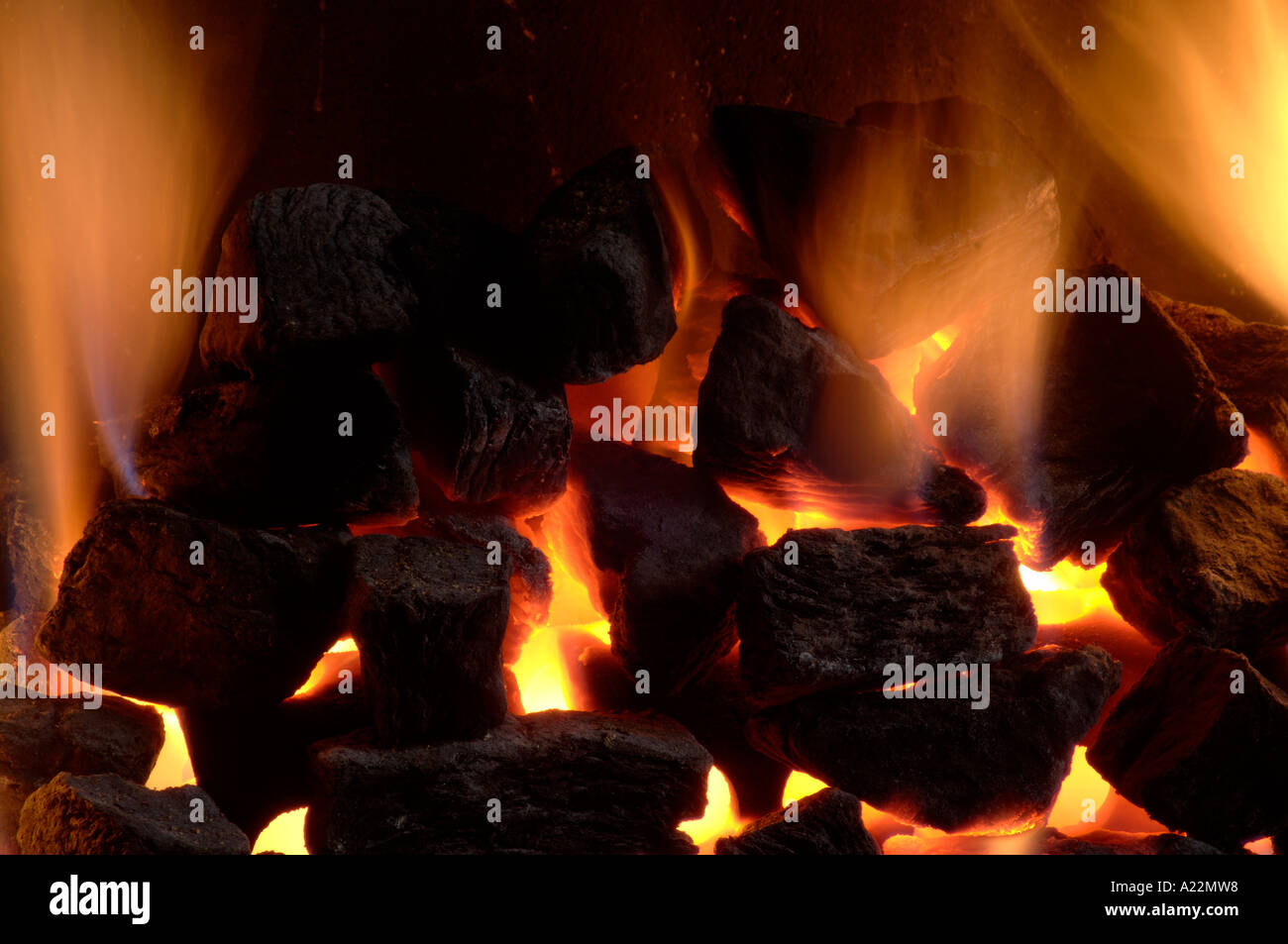 glowing coals and flames on a gas powered fire Stock Photo - Alamy
