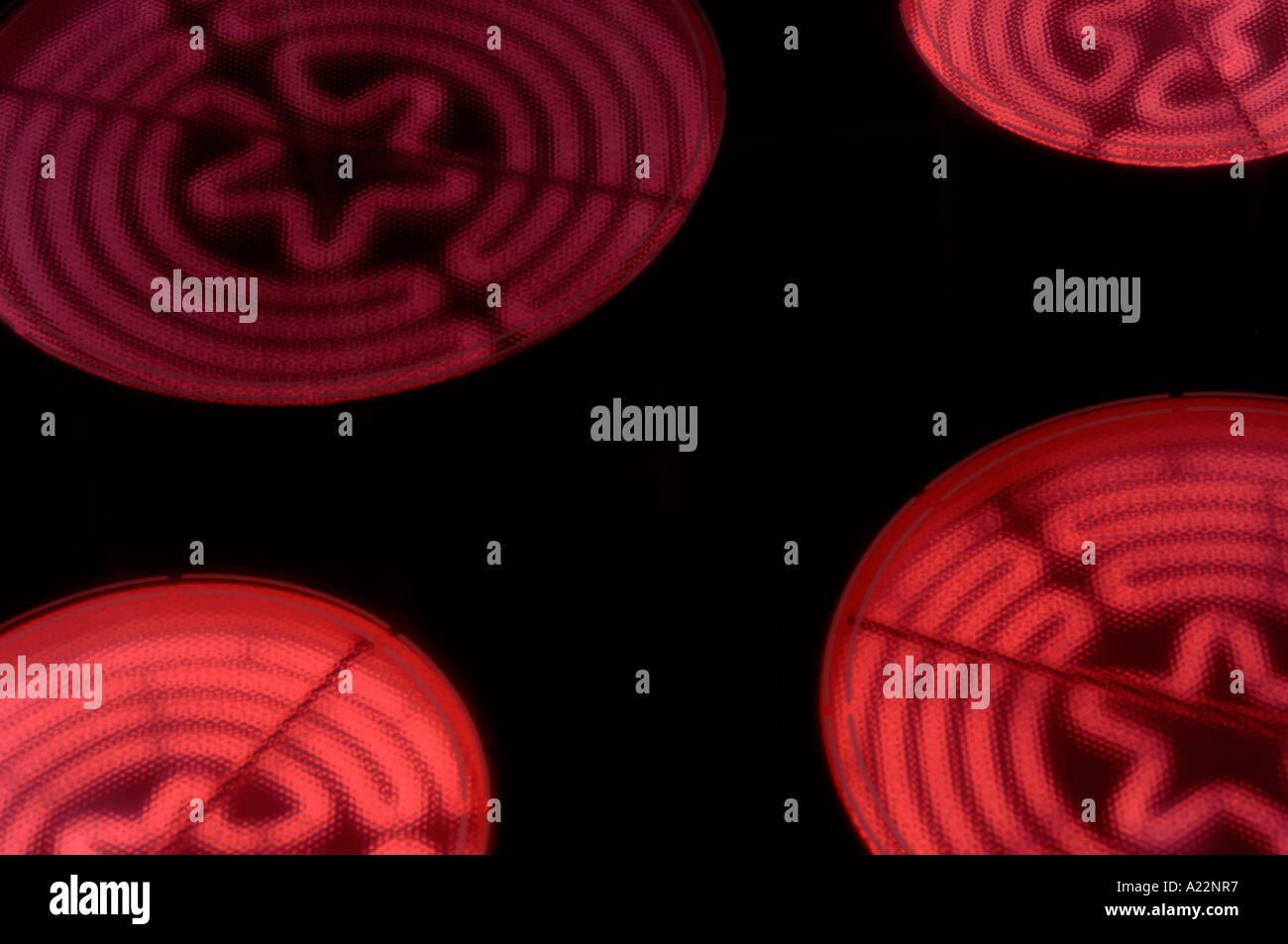 Four glowing hot plates on an electric halogen kitchen hob Stock Photo ...