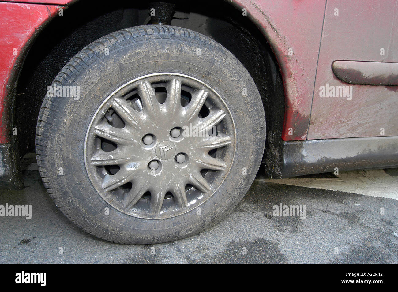 A wheel covered in road salt Stock Photo - Alamy