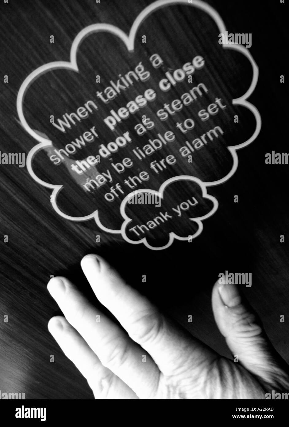 Hand with door sign Stock Photo - Alamy