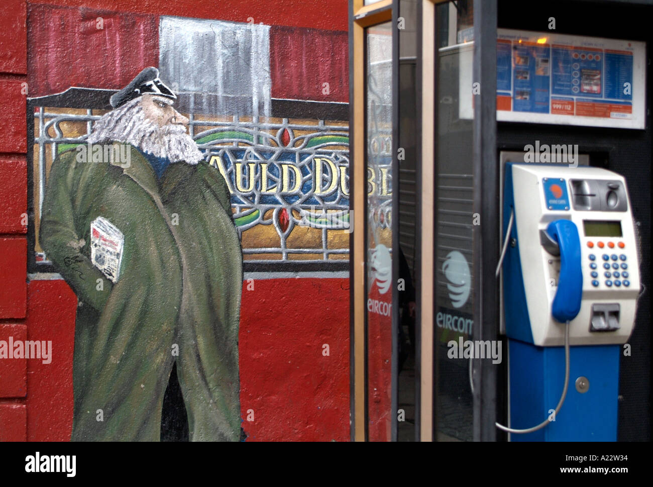 wall art juxtaposed with modern telephone box dublin irleland Stock ...