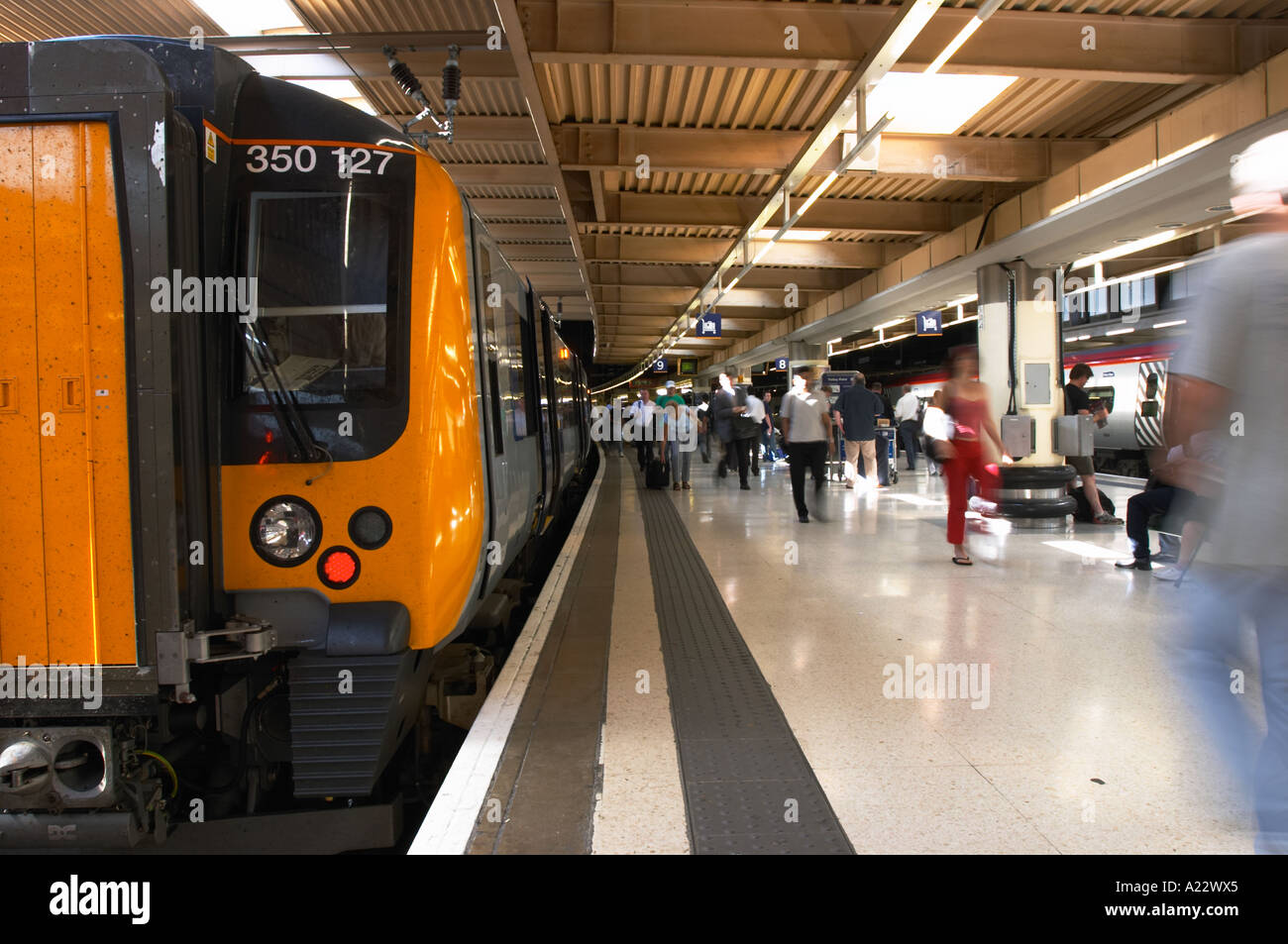 Euston Station platform Motion blur of passengers moving to and from ...