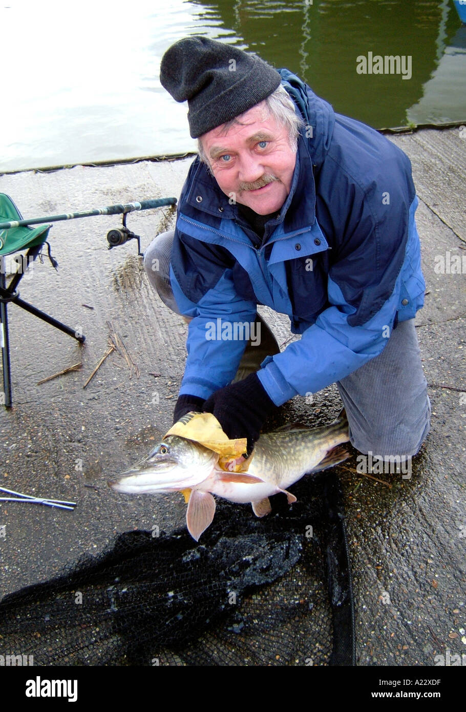 man shows off recently caught pike Stock Photo - Alamy