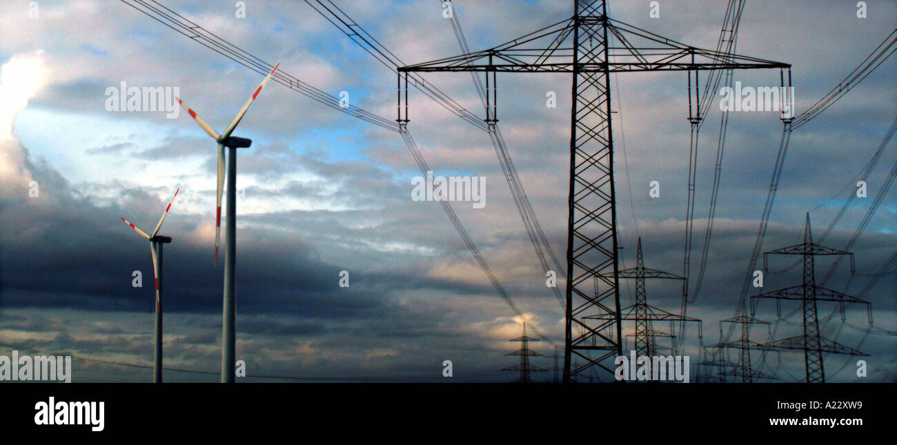 Electricity Pylons And Wind Turbines Stock Photo - Alamy