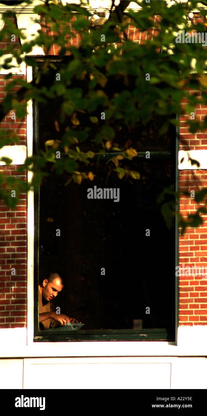 man in window amsterdam Stock Photo - Alamy
