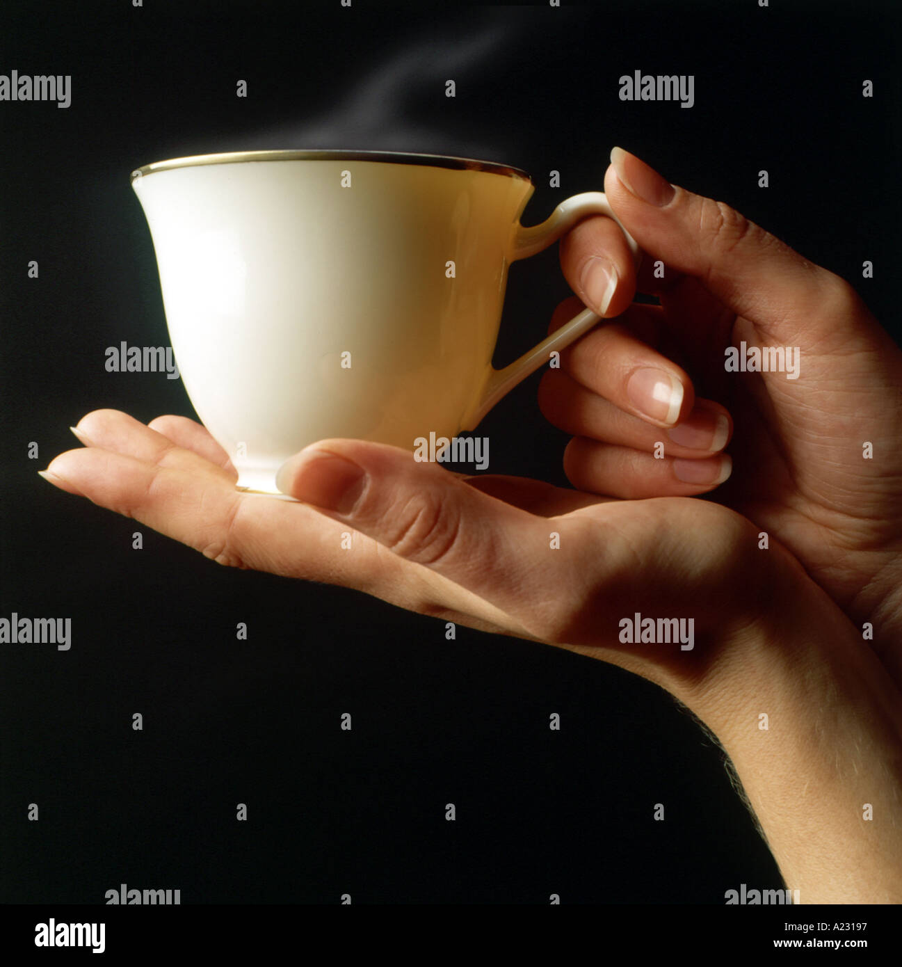 Woman hand picking up cup hi-res stock photography and images - Alamy