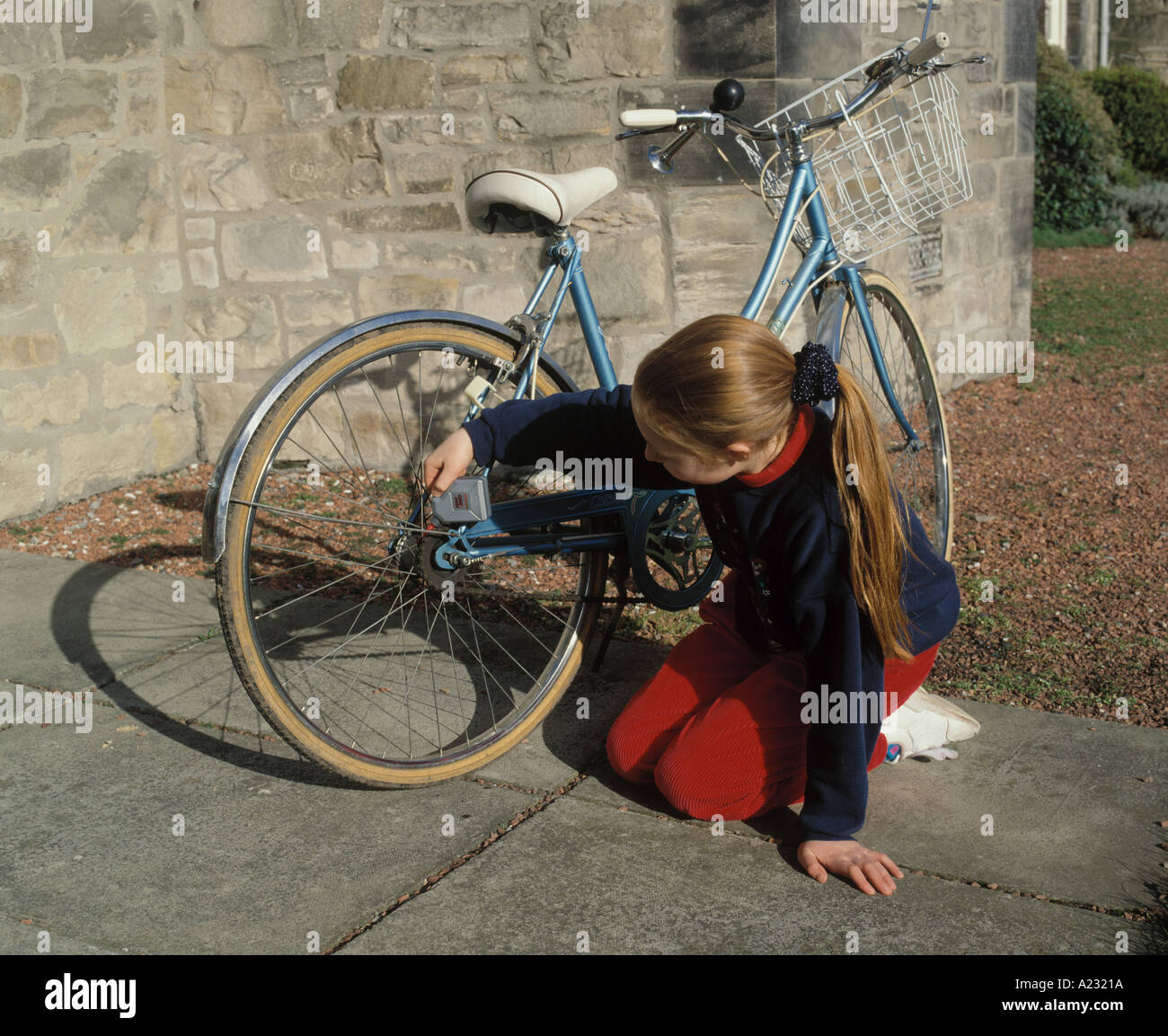 Girl oiling bicycle chain hi-res stock photography and images - Alamy
