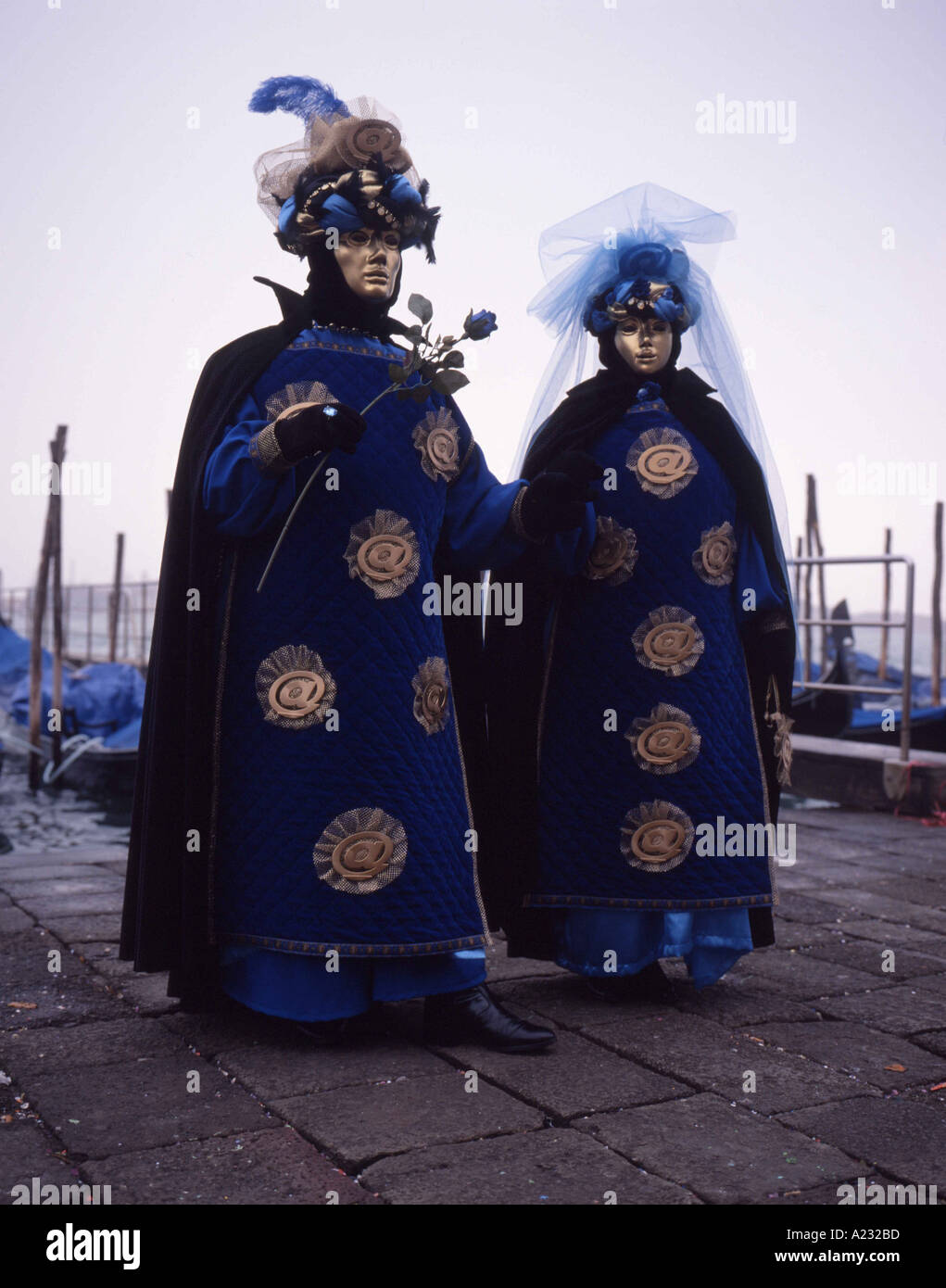 Carnival characters by canal Venice carnival Italy Stock Photo - Alamy