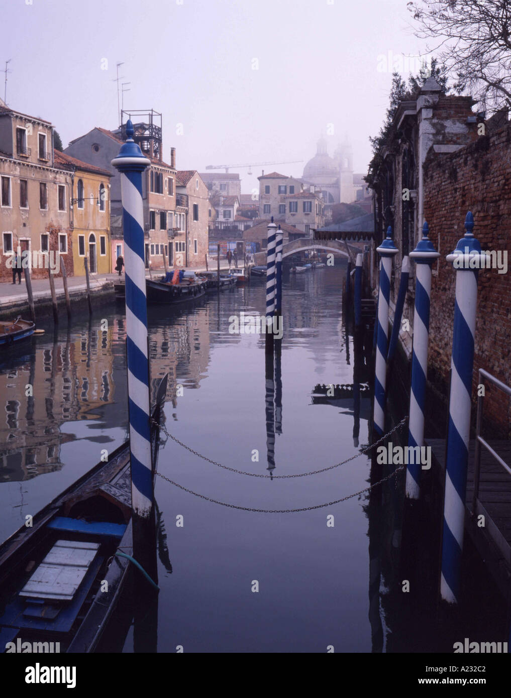 Blue and white striped mooring poles canal Venice Italy Stock Photo - Alamy