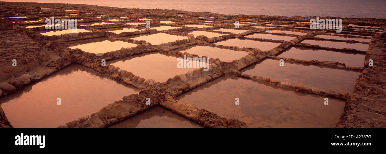 Salt pans on the coast at Xwejni Bay on the island of Gozo Stock Photo ...