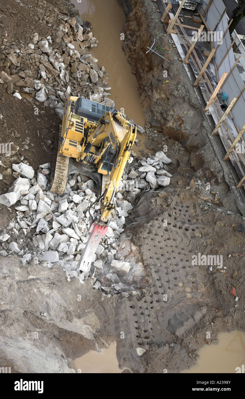 Large ground breaking machine at construction site Stock Photo - Alamy