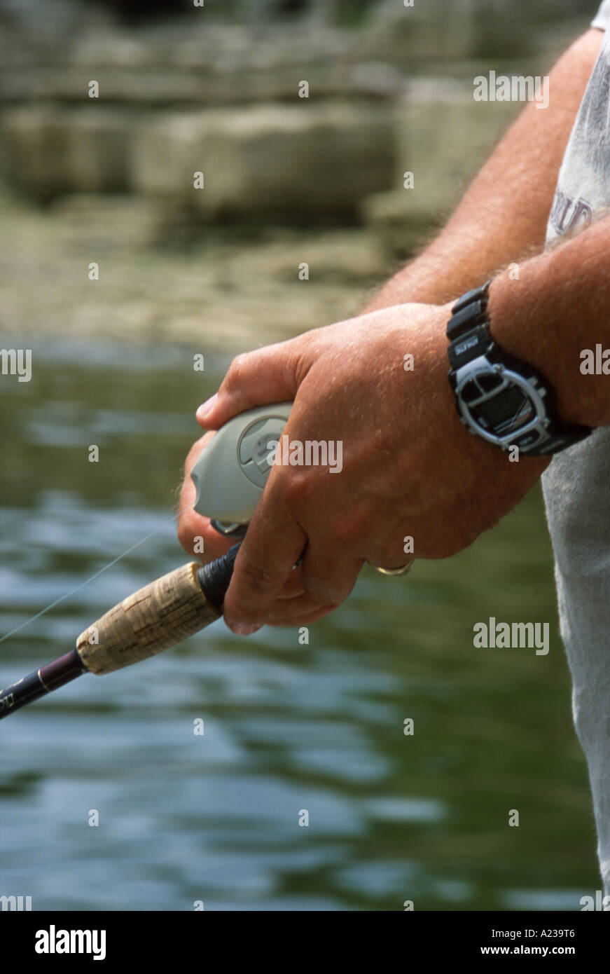Fishermans hands spinning reel close hi-res stock photography and ...