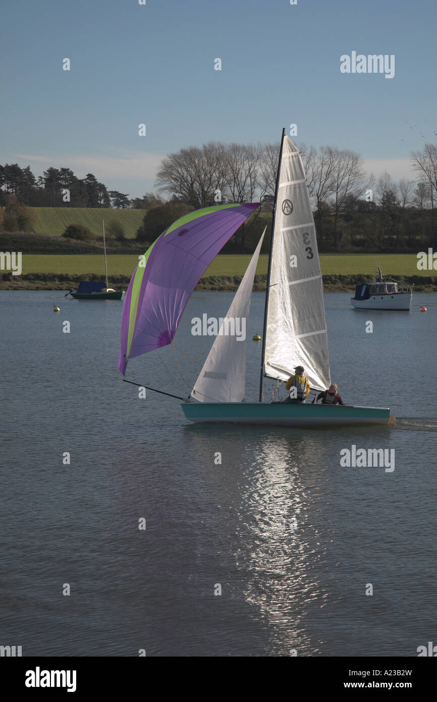 Two person sailing dinghy with jib, main sail and spinnaker River Deben ...