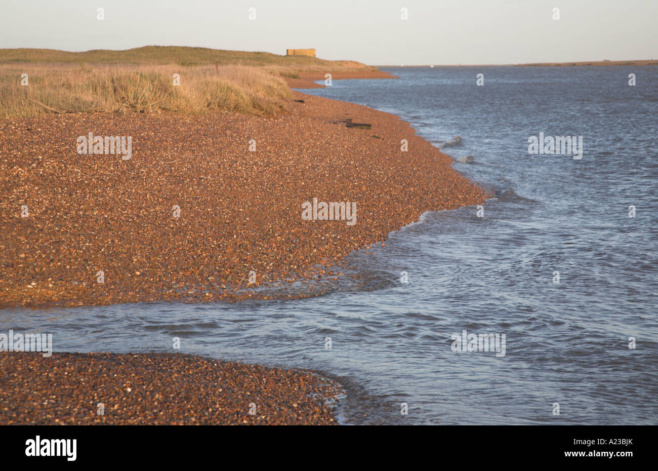 Shingle beach and small tributary joing River Ore, Hollesley, Suffolk ...