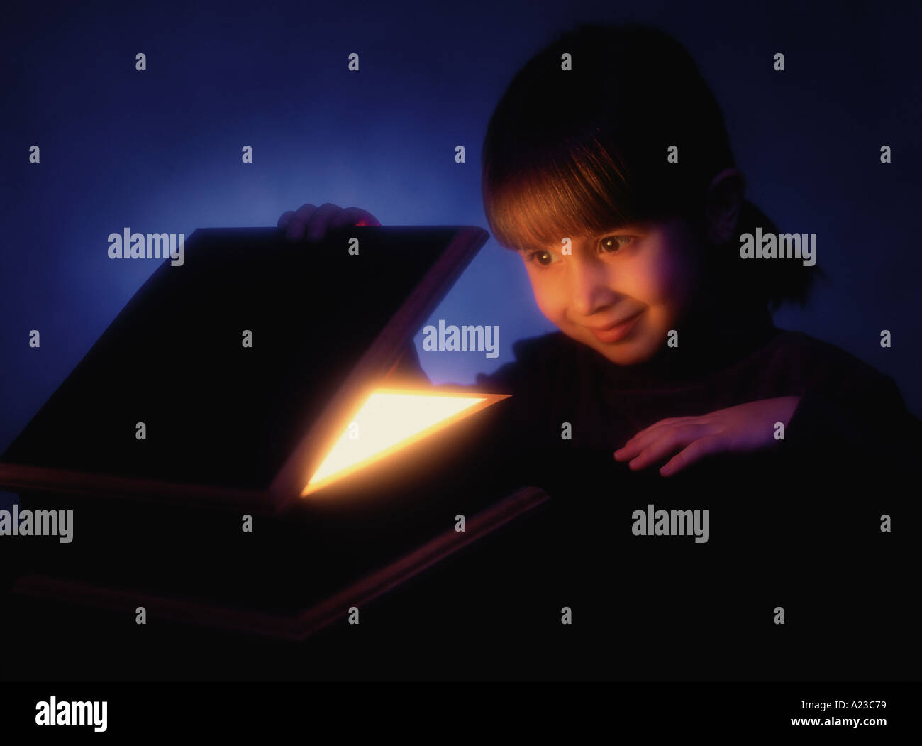 child looking into box Stock Photo - Alamy