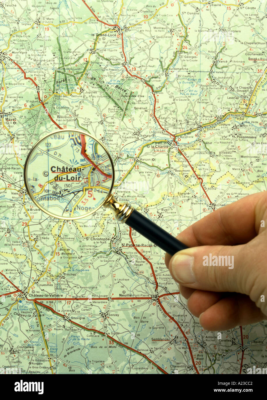 a magnifying glass being used to read a French map Stock Photo - Alamy