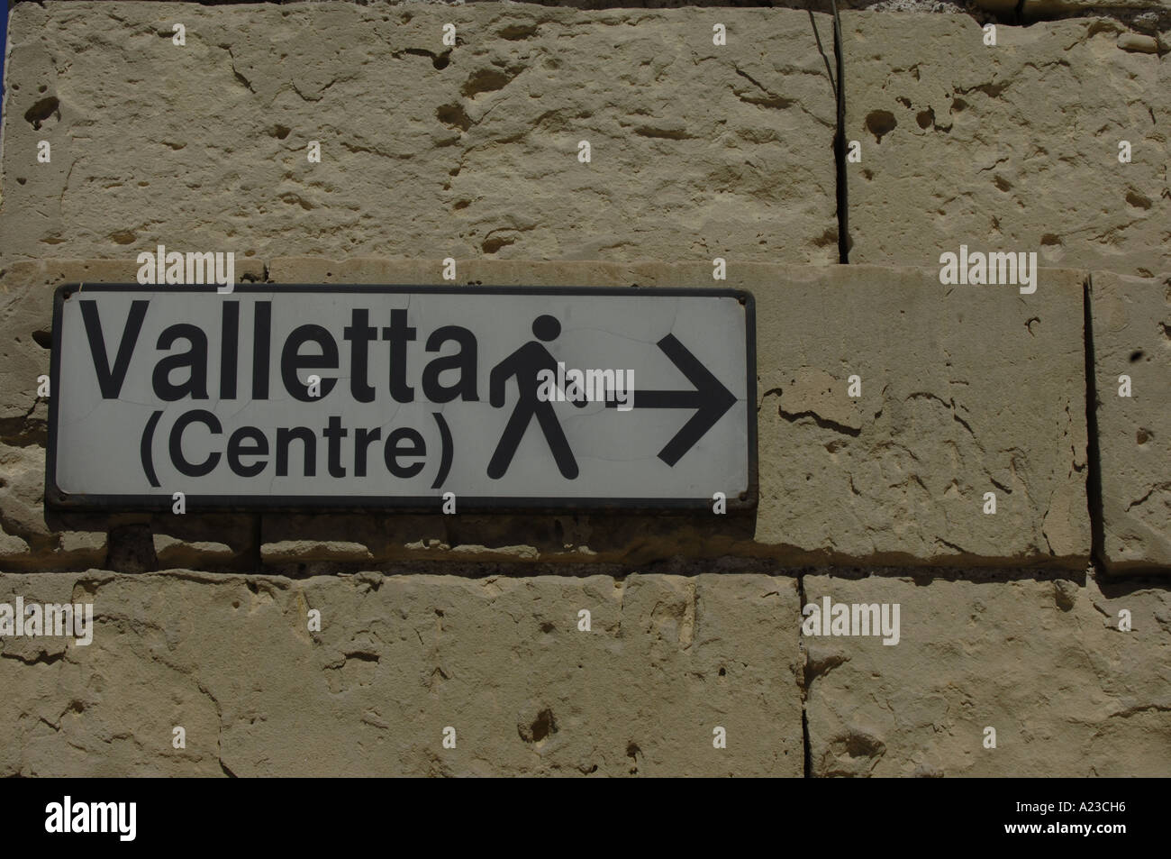 valletta centre sign pedestrians direction right stone wall Stock Photo ...