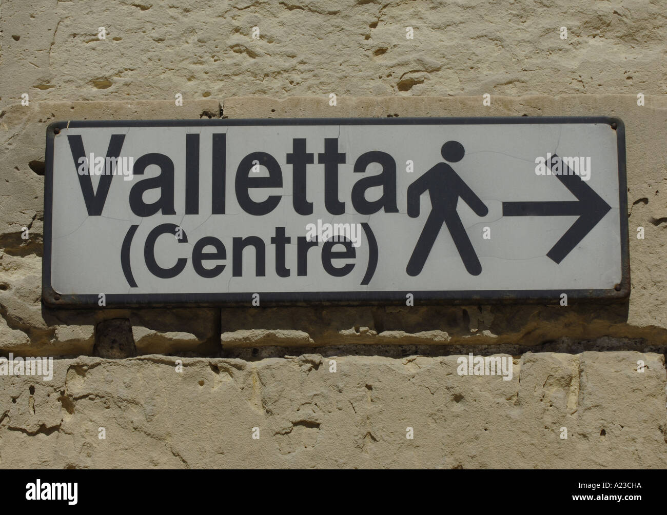 valletta centre sign pedestrians direction right stone wall horizontal ...
