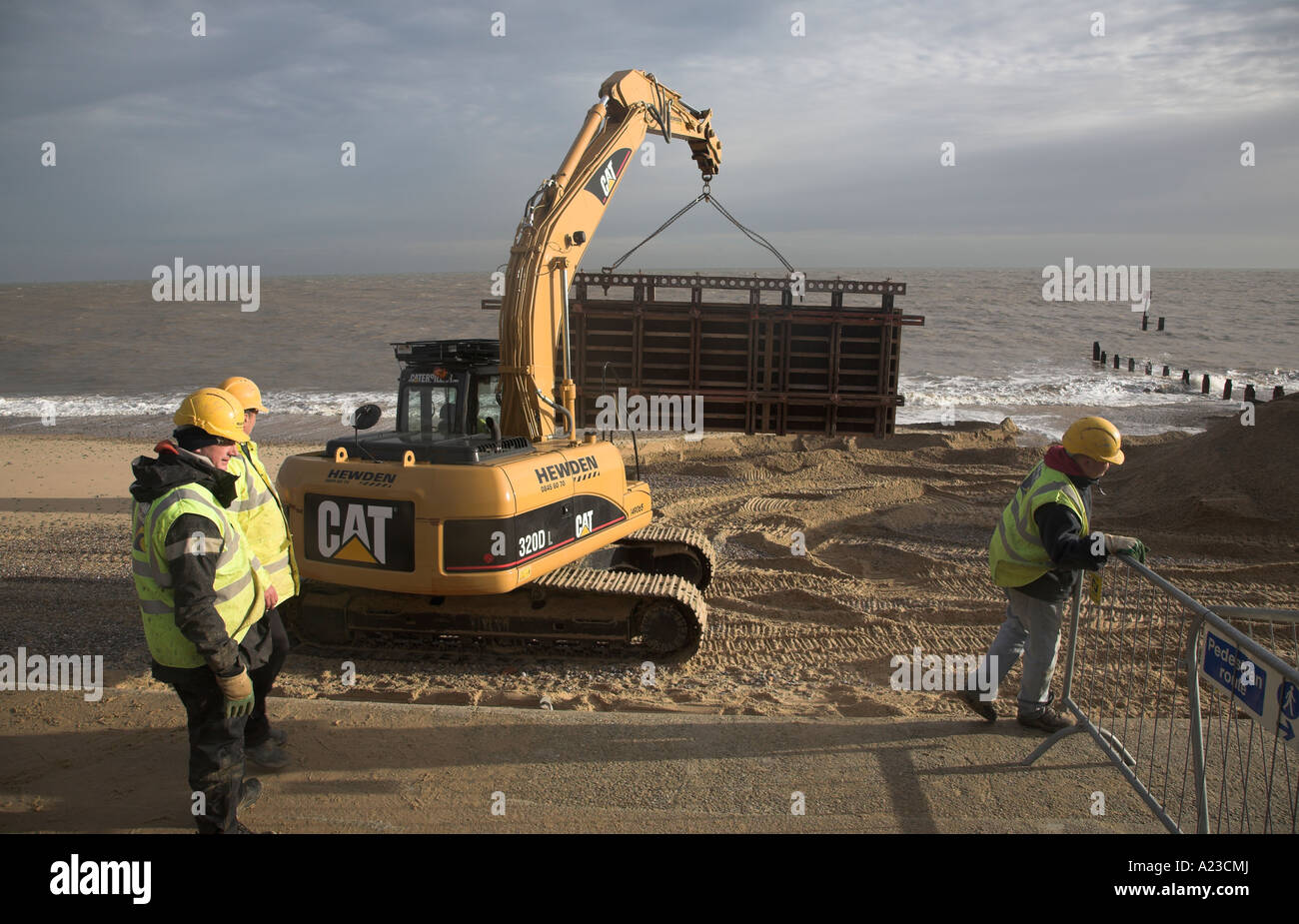 Engineering work to repair sea defences Stock Photo - Alamy